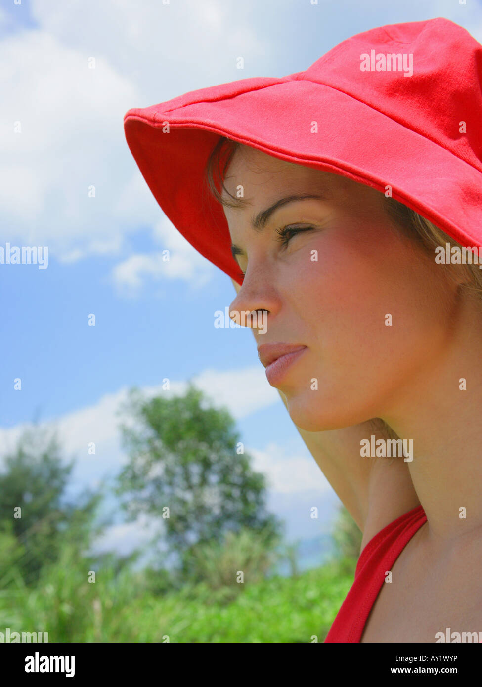 Woman hand behind head smiling hi-res stock photography and images - Alamy