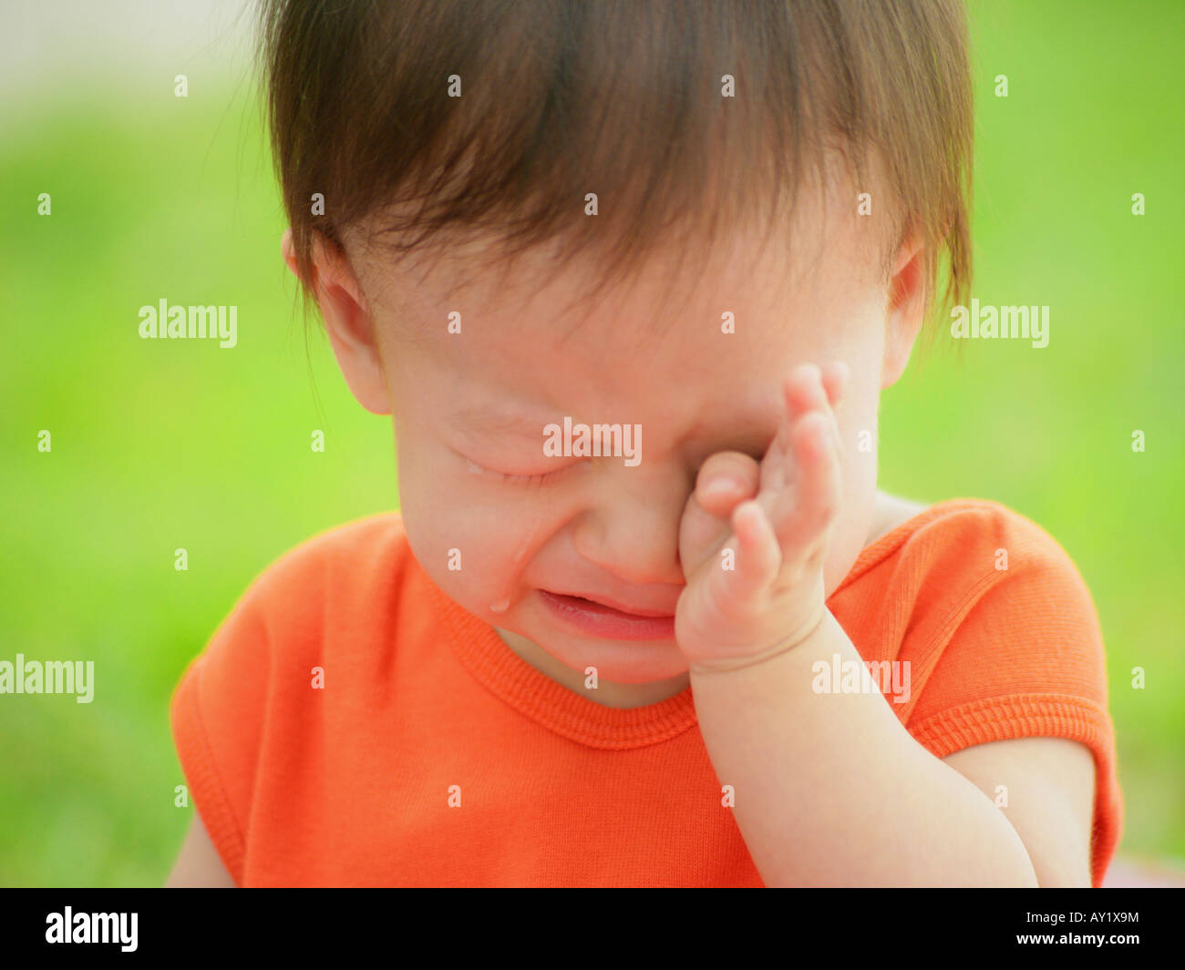 Close-up of a baby girl crying Stock Photo - Alamy