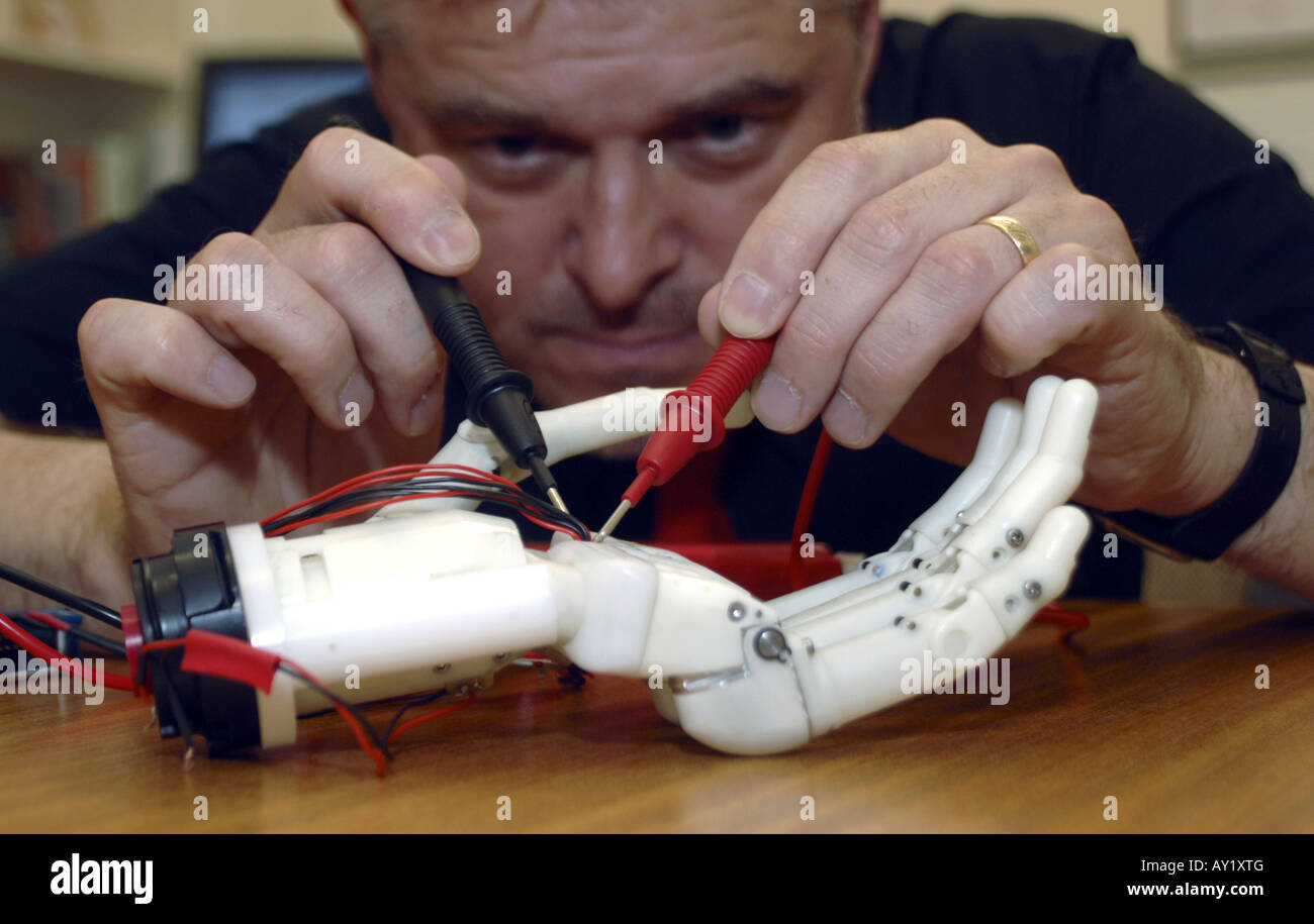 Inventor working on a robotic hand Stock Photo - Alamy