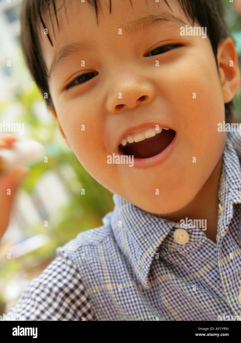 Portrait of a boy laughing Stock Photo - Alamy