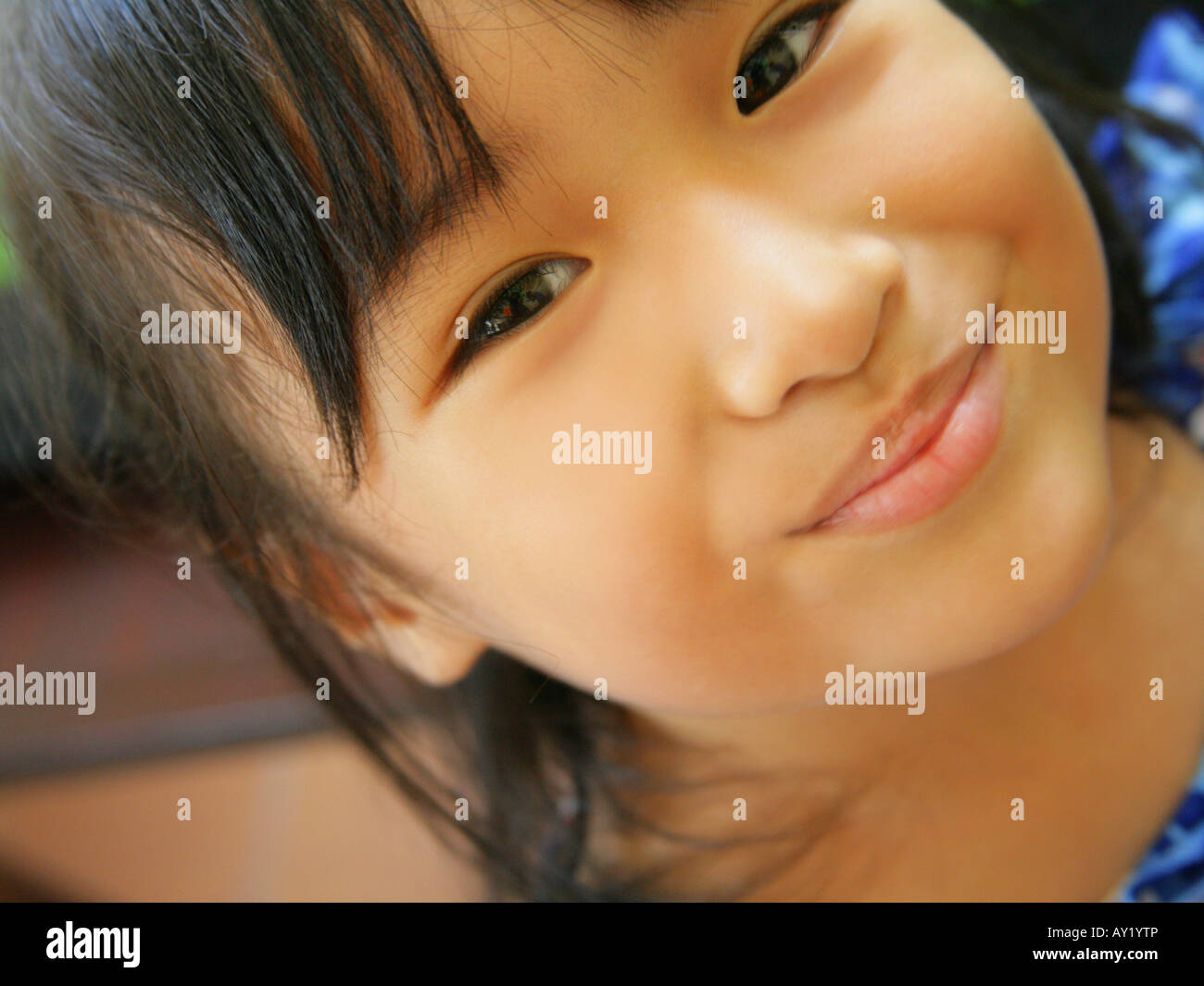 Portrait of a girl grinning Stock Photo - Alamy
