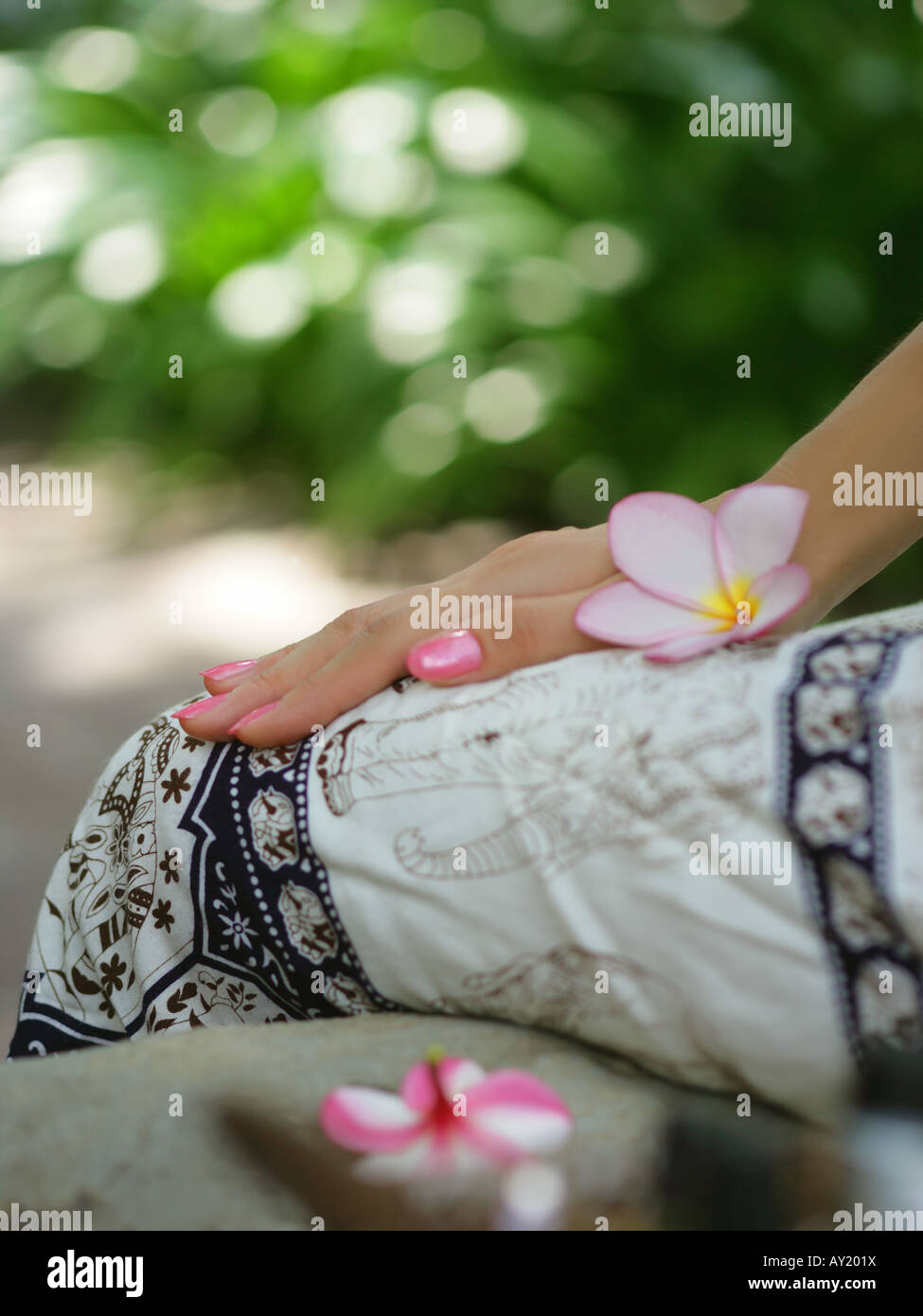 Mid section view of a woman sitting Stock Photo - Alamy