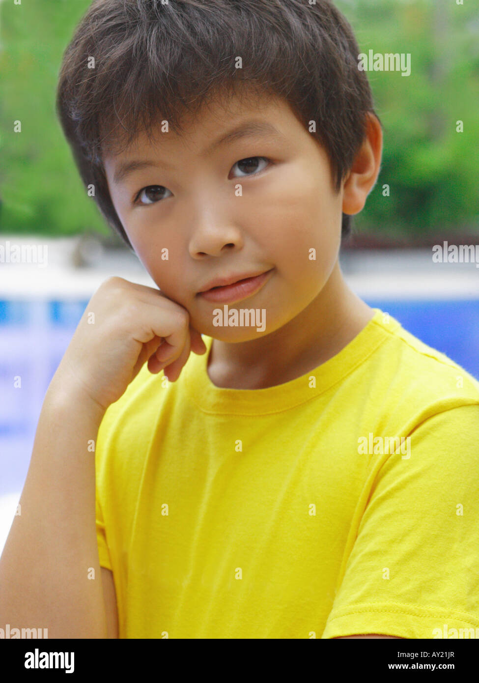 Close-up of a boy thinking Stock Photo - Alamy