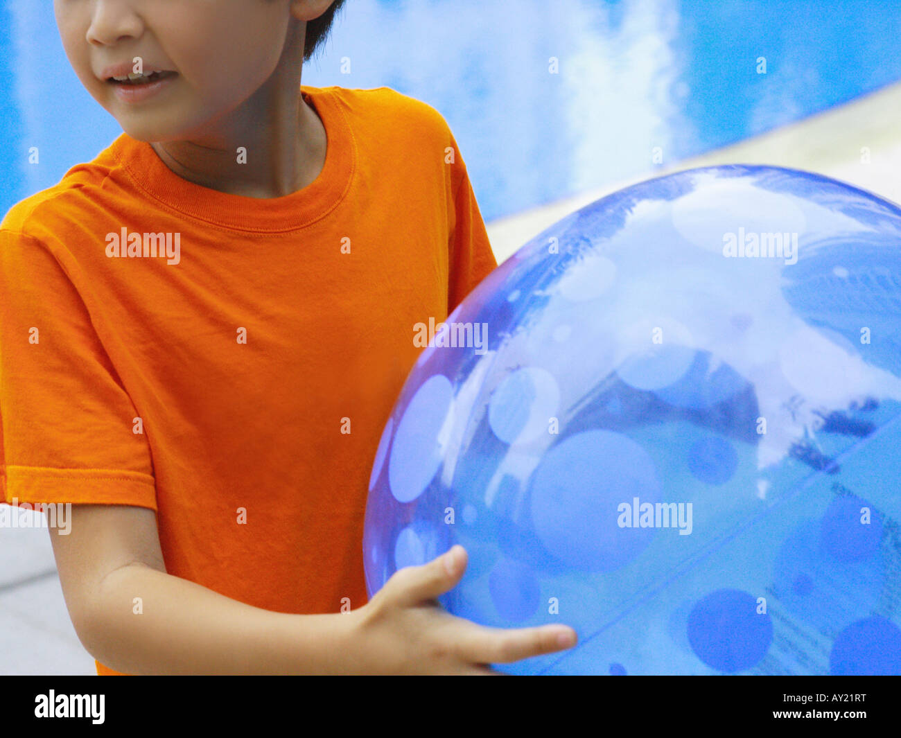 Close-up of a boy holding a ball Stock Photo - Alamy