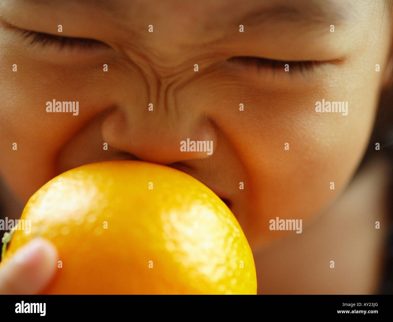 Asian girl biting finger hi-res stock photography and images - Alamy