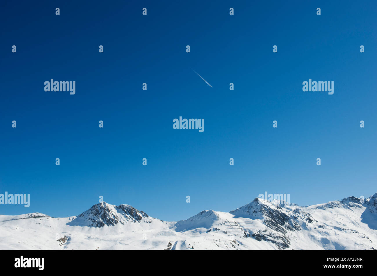 french alps in winter with jet aircraft passing overhead Stock Photo ...