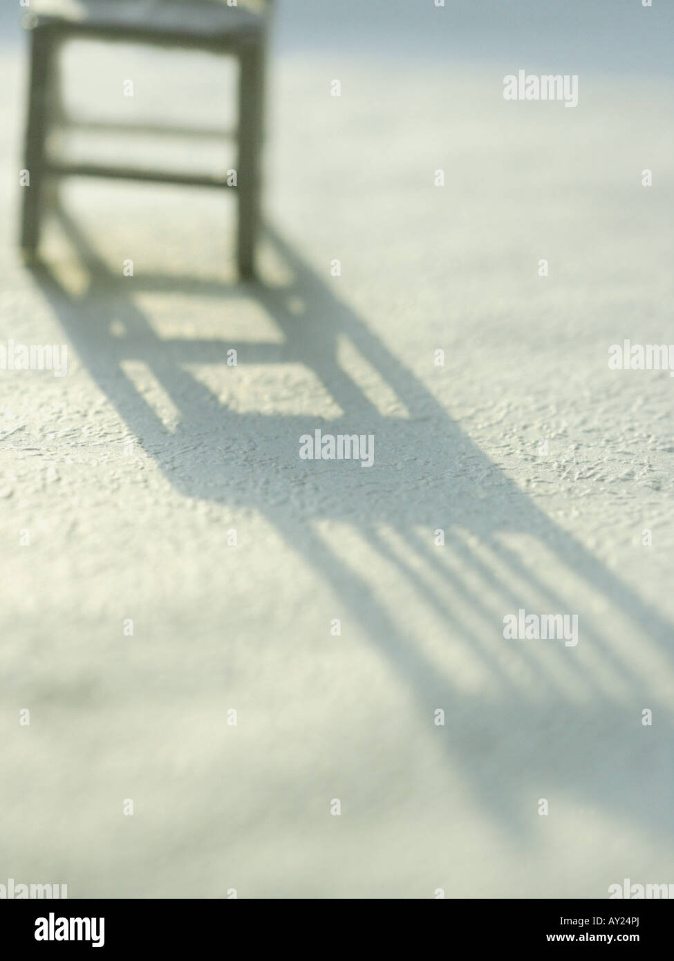 Shadow of an empty chair Stock Photo - Alamy