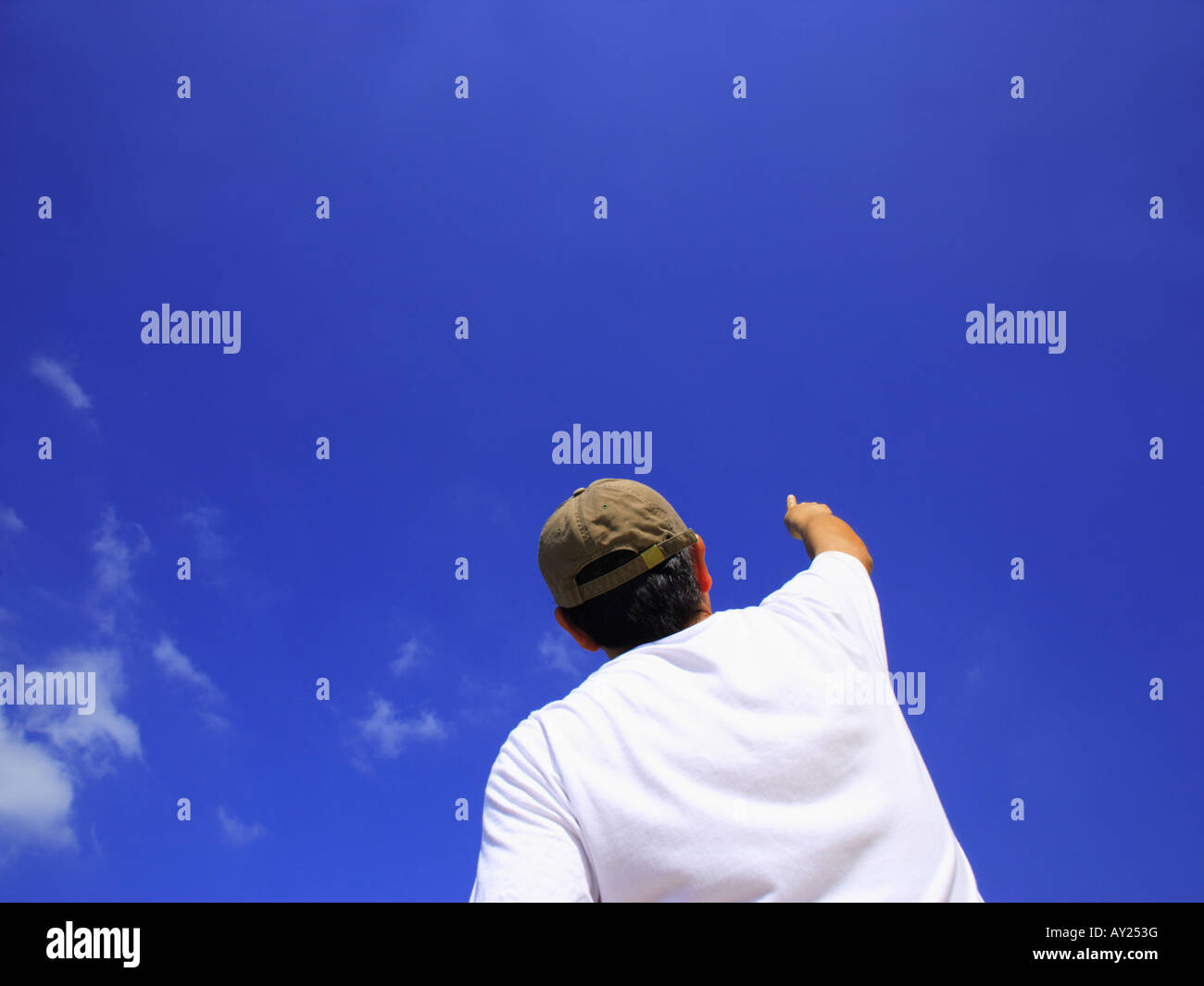 Low angle view of a man pointing upwards Stock Photo - Alamy
