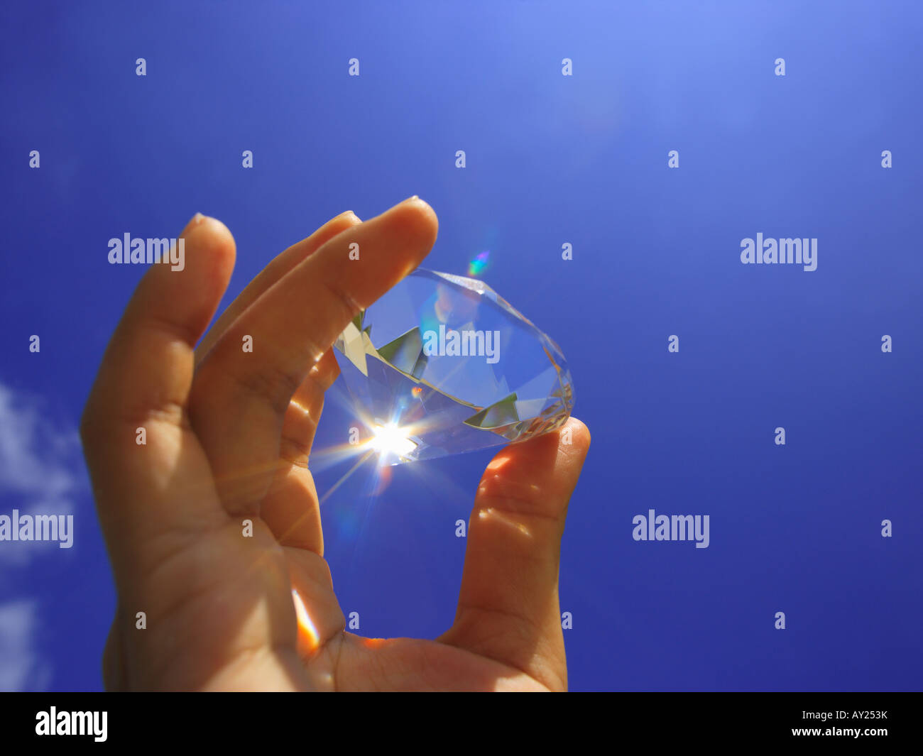 Close-up of a person's hand holding a diamond Stock Photo - Alamy