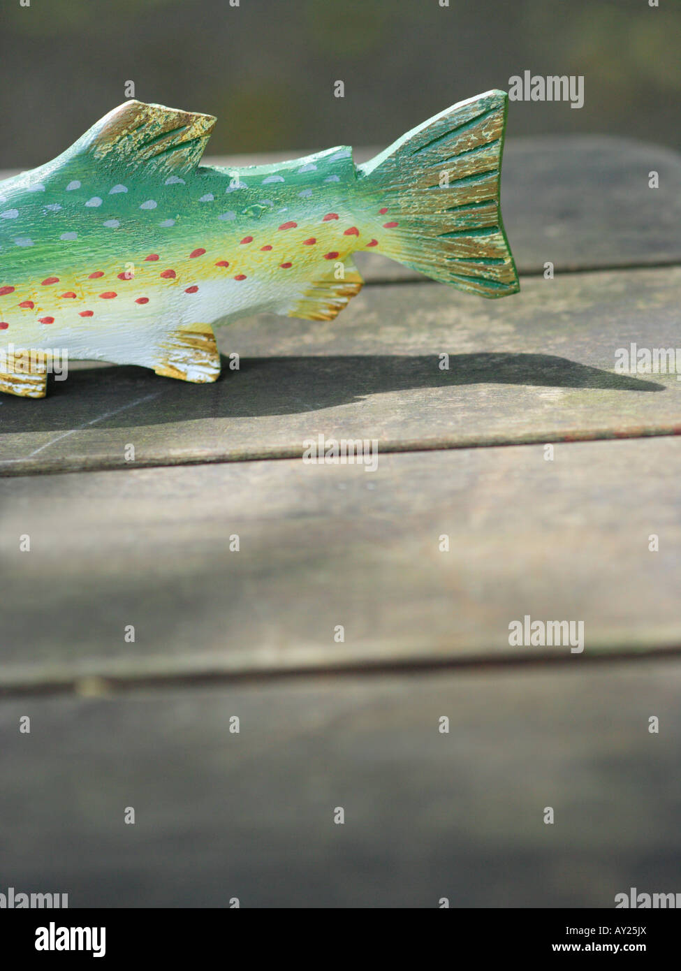 Close-up of a wooden fish on the table Stock Photo - Alamy