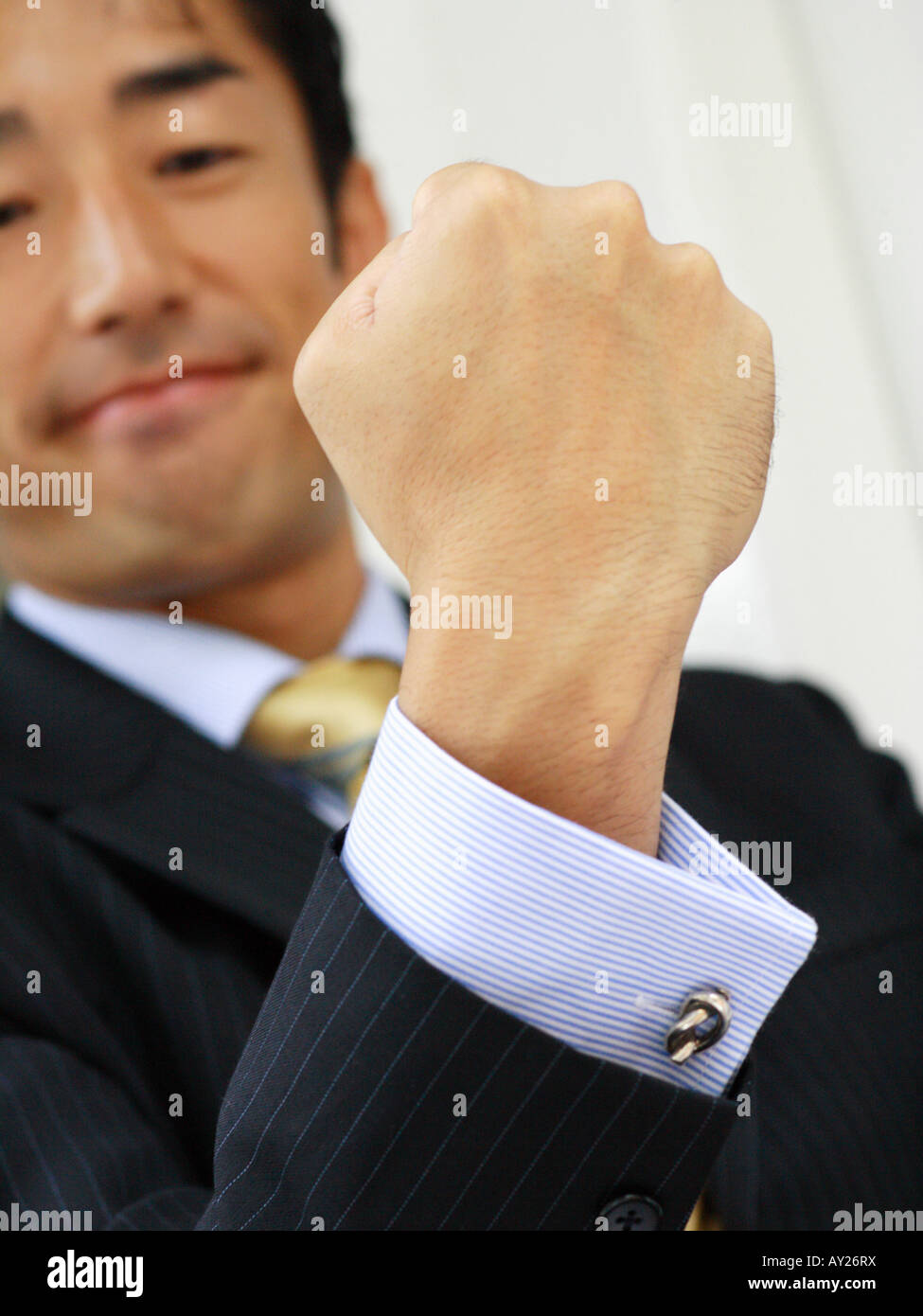 Portrait of a businessman showing his fist Stock Photo - Alamy