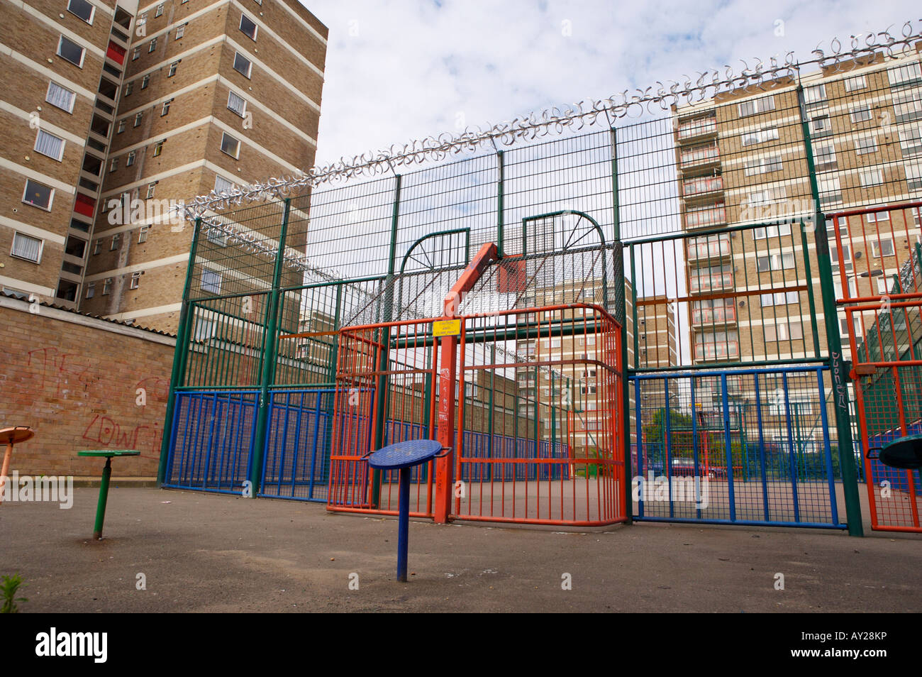 Playground on a council estate with high rise buildings Stock Photo - Alamy