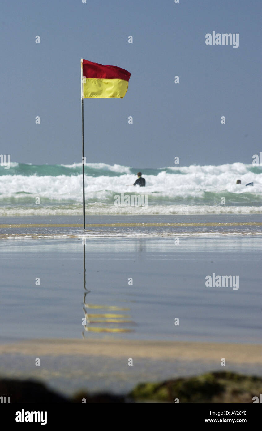 Lifeguard flag on beach Stock Photo - Alamy