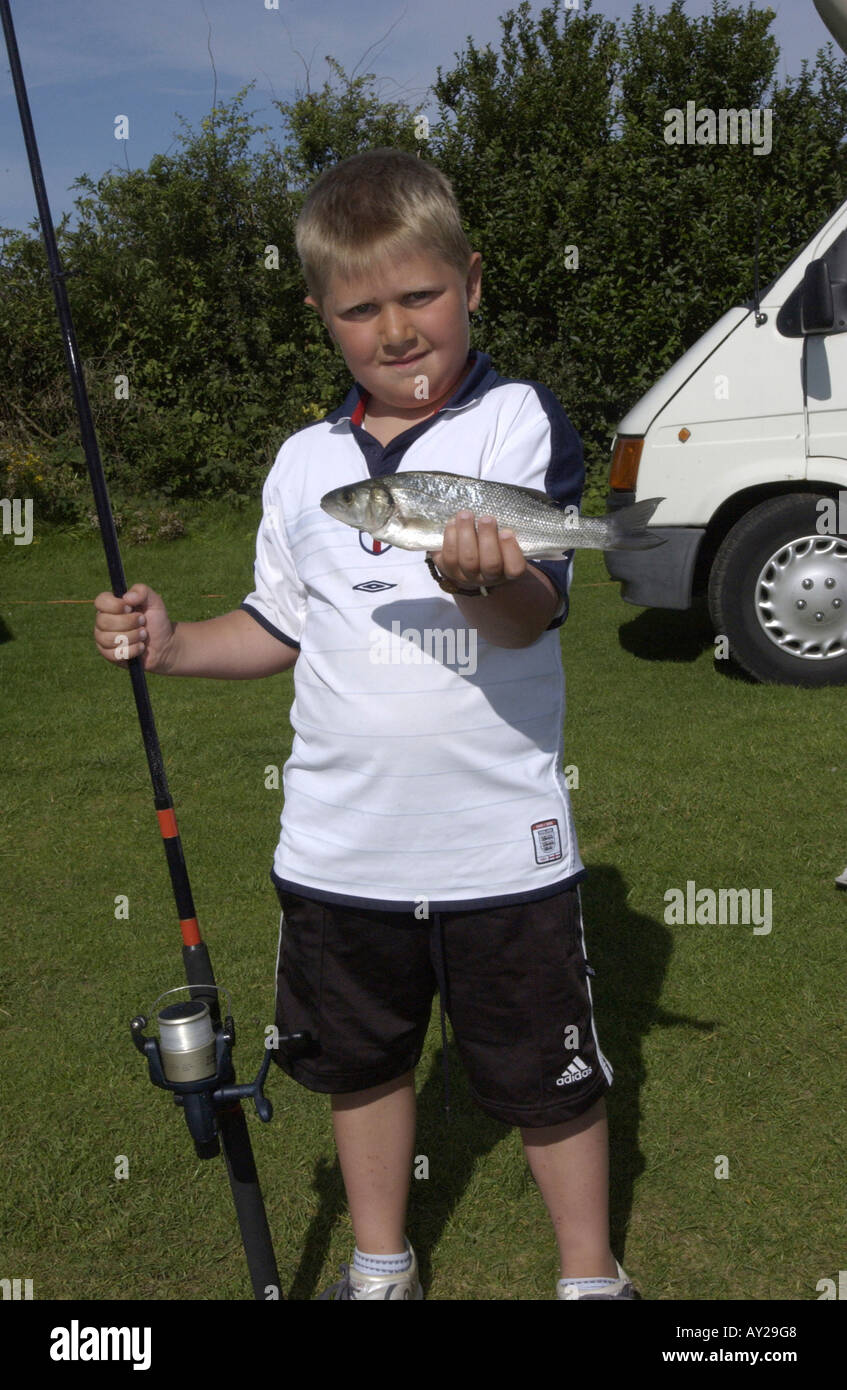 Boy with Fish Stock Photo - Alamy