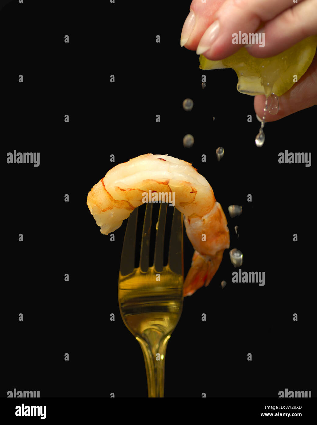lemon spray on shrimp Stock Photo - Alamy