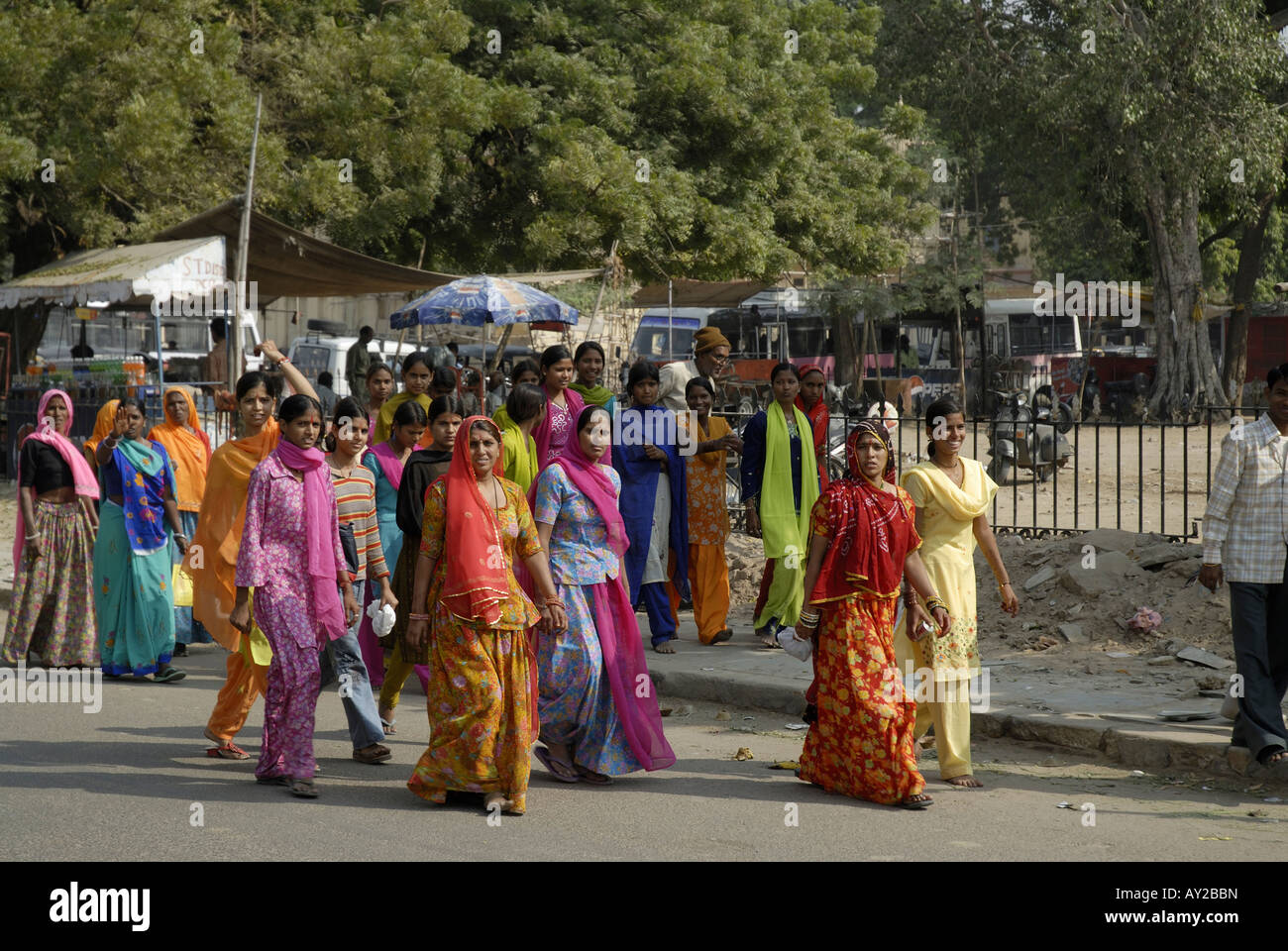 Hindu Ladies in colourful saris walking from Temple after worship ...