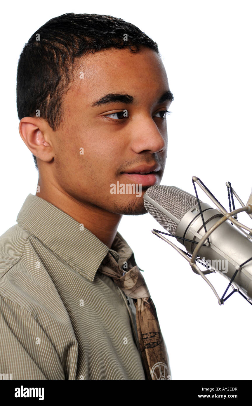 Young singer using a vintage microphone Stock Photo - Alamy
