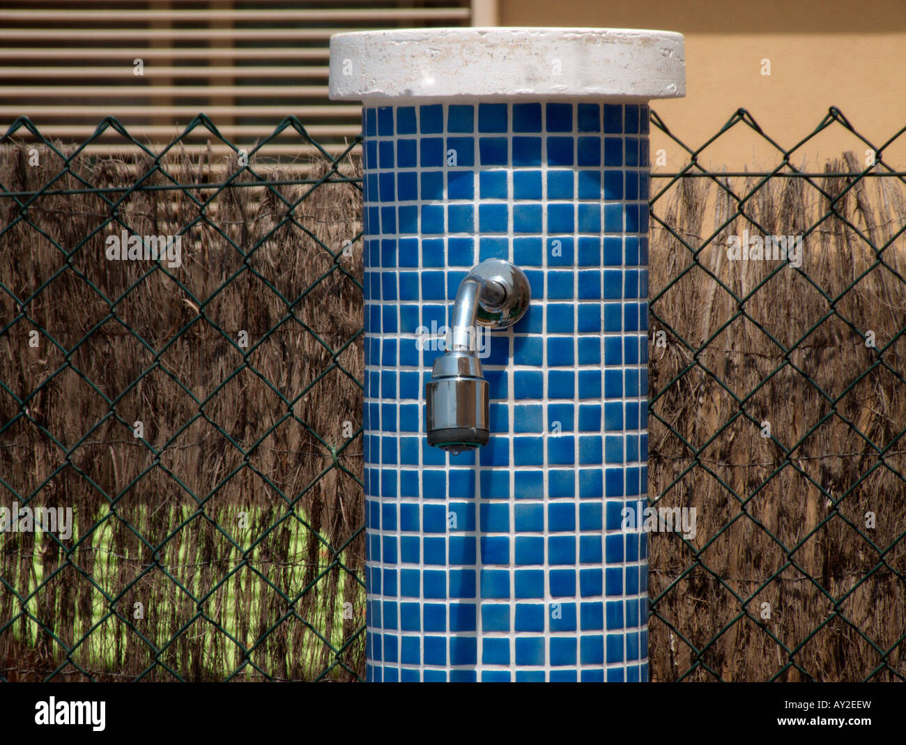 Swimming pool shower, with blue mosaic tile column, as the pool Stock ...