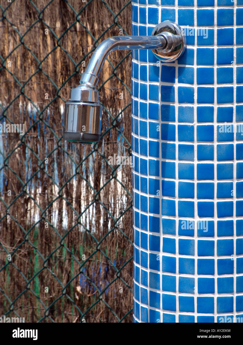 Swimming pool shower, with blue mosaic tile column, as the pool Stock ...