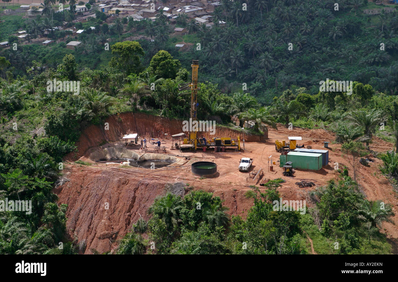 Aerial of exploration drilling in bush, surface gold mine with African ...