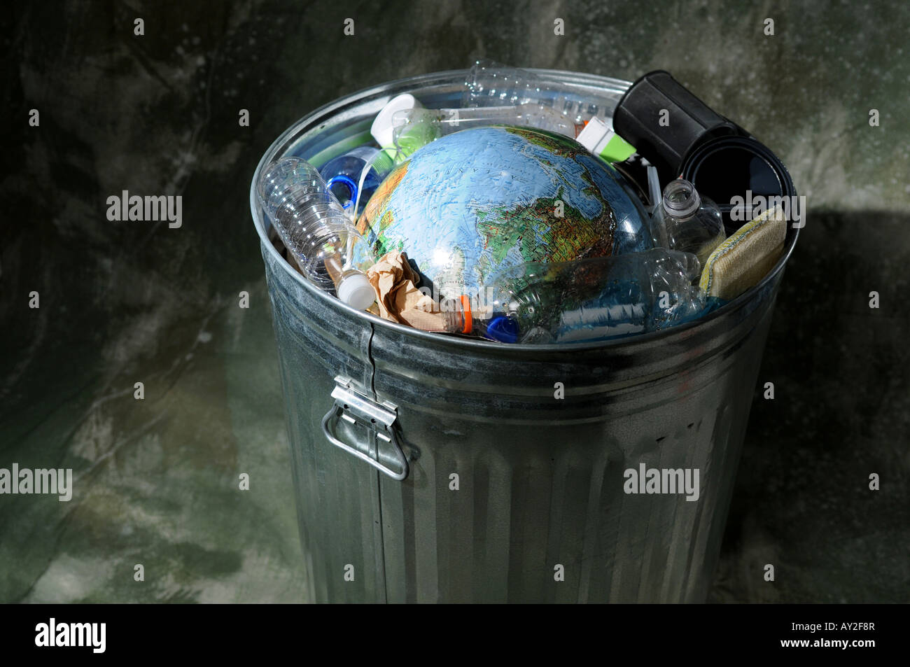 Earth in a trash can with plastics and rubbish Stock Photo - Alamy
