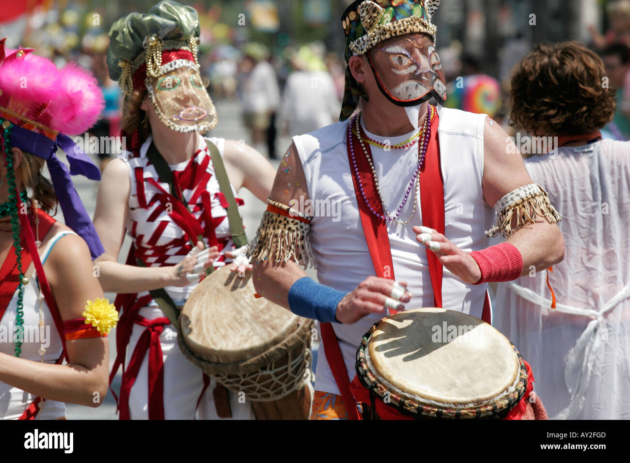 Drumers, members of the "Dancing Drum" marching down State street ...