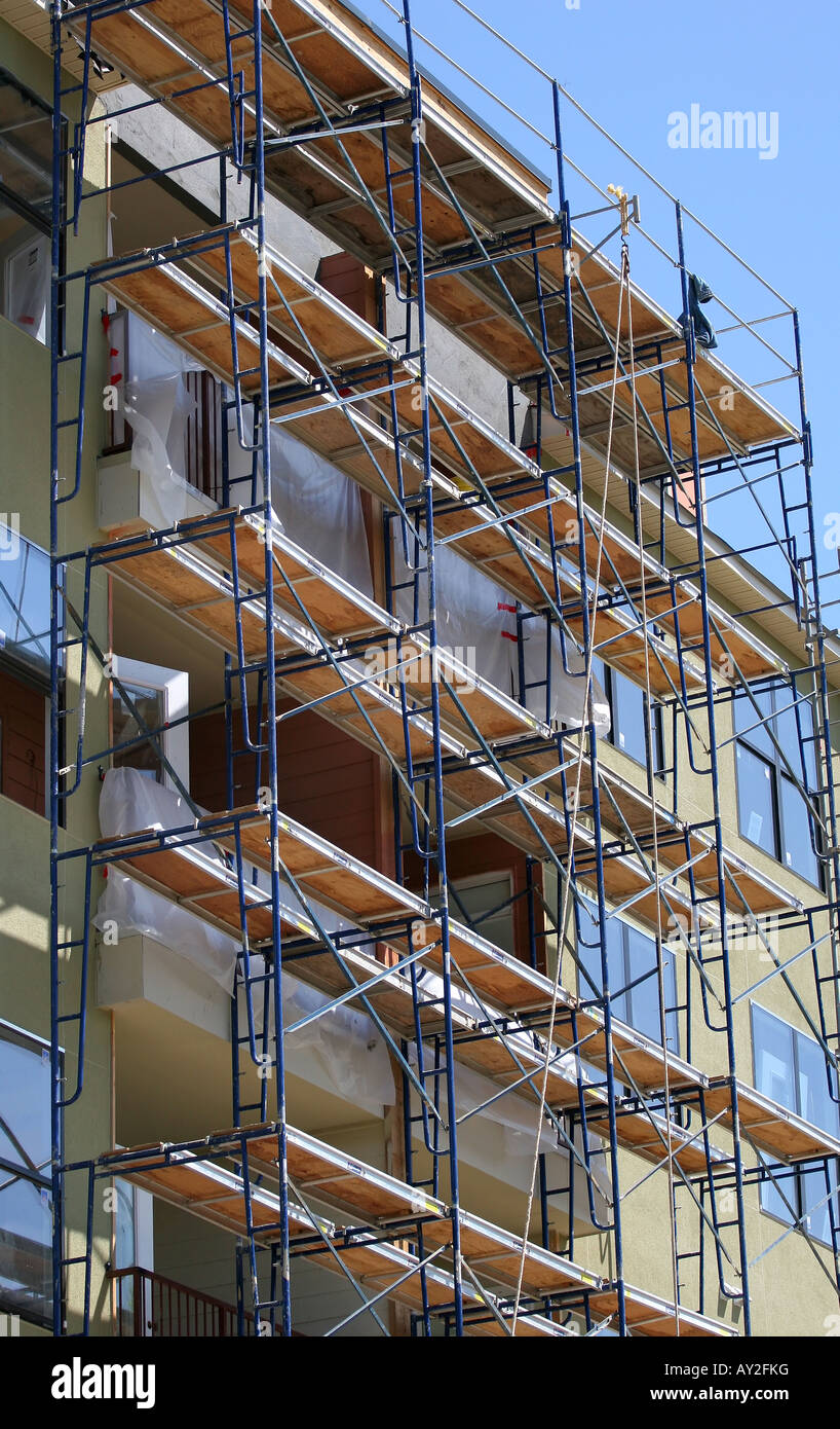 New condo construction with a blue scaffolding in place Stock Photo - Alamy