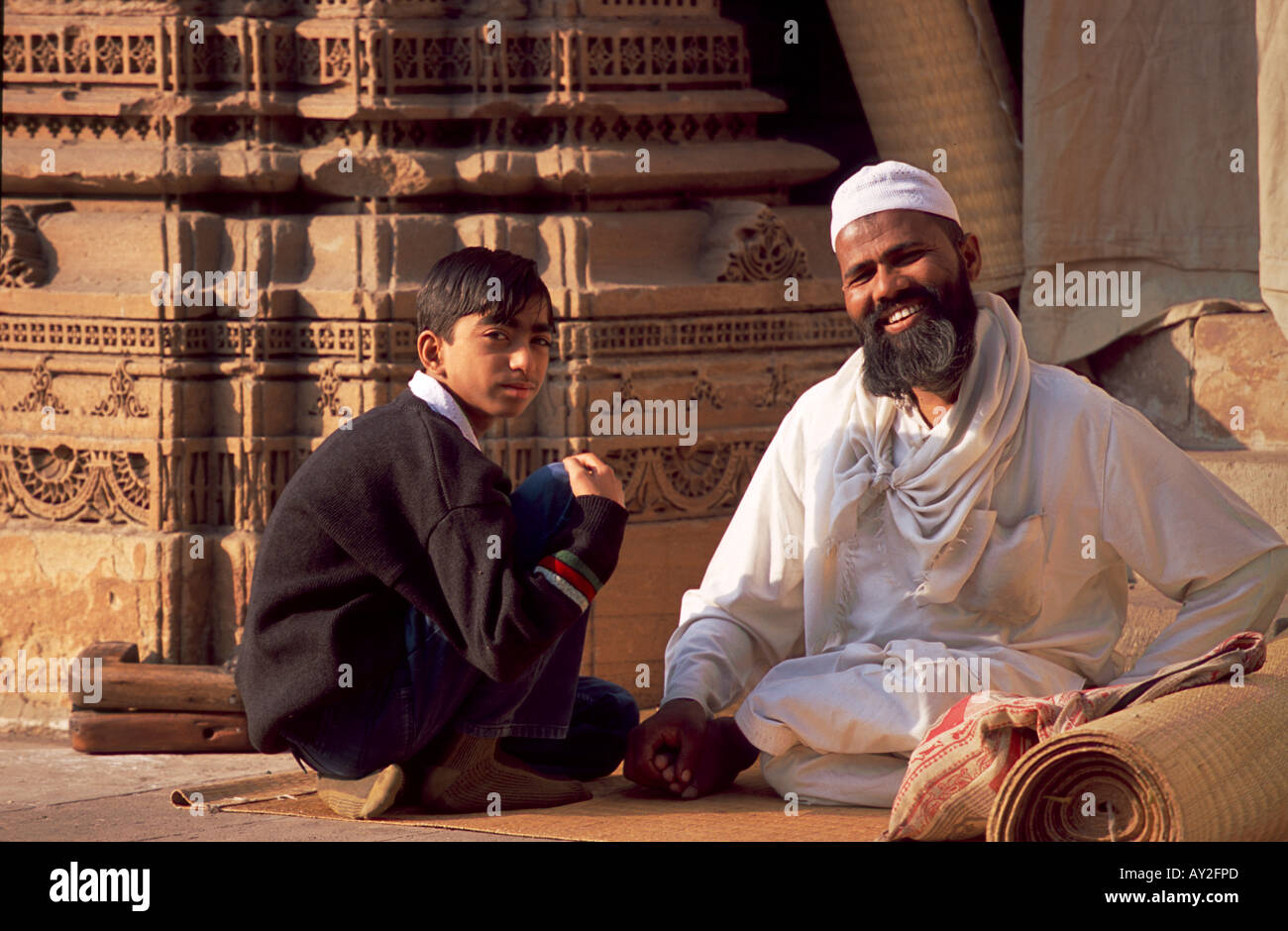 Indian man teaching boy hi-res stock photography and images - Alamy