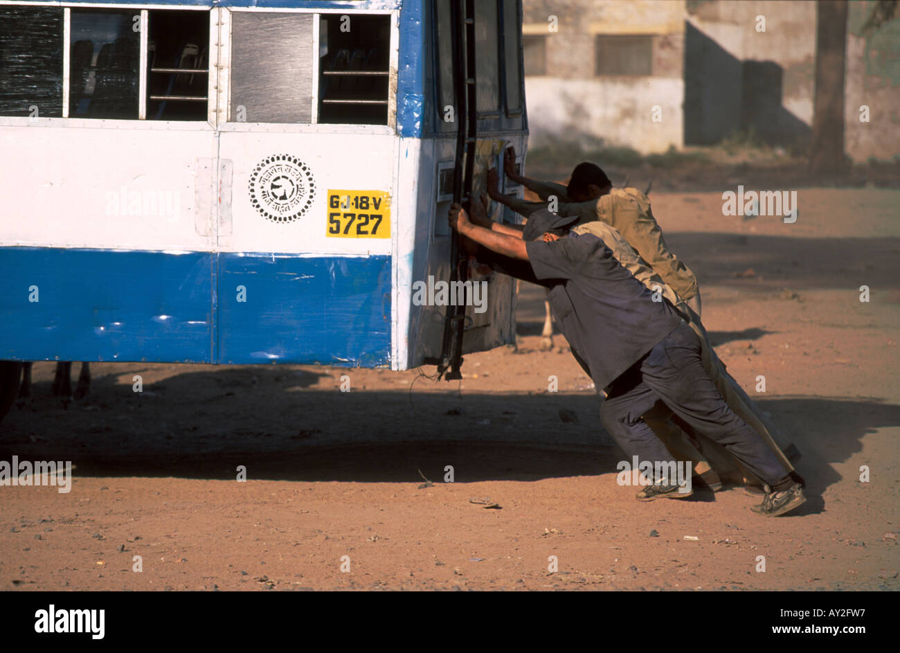 Indian men pushing bus hi-res stock photography and images - Alamy