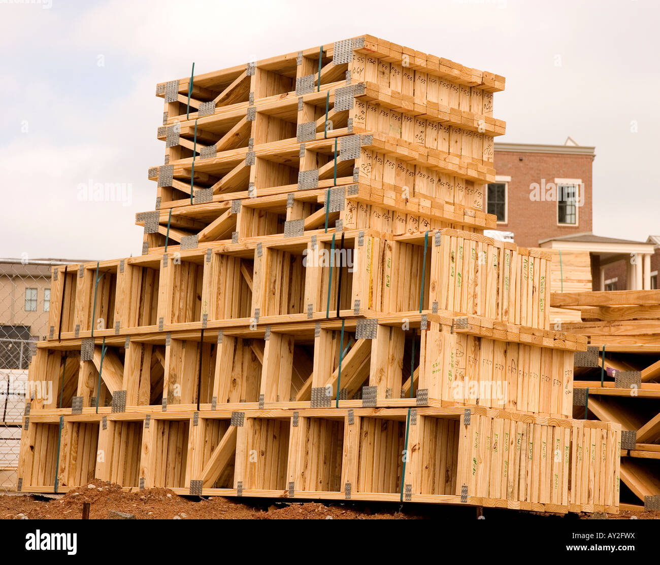 Wood roof trusses stacked up at a construction site Stock Photo - Alamy
