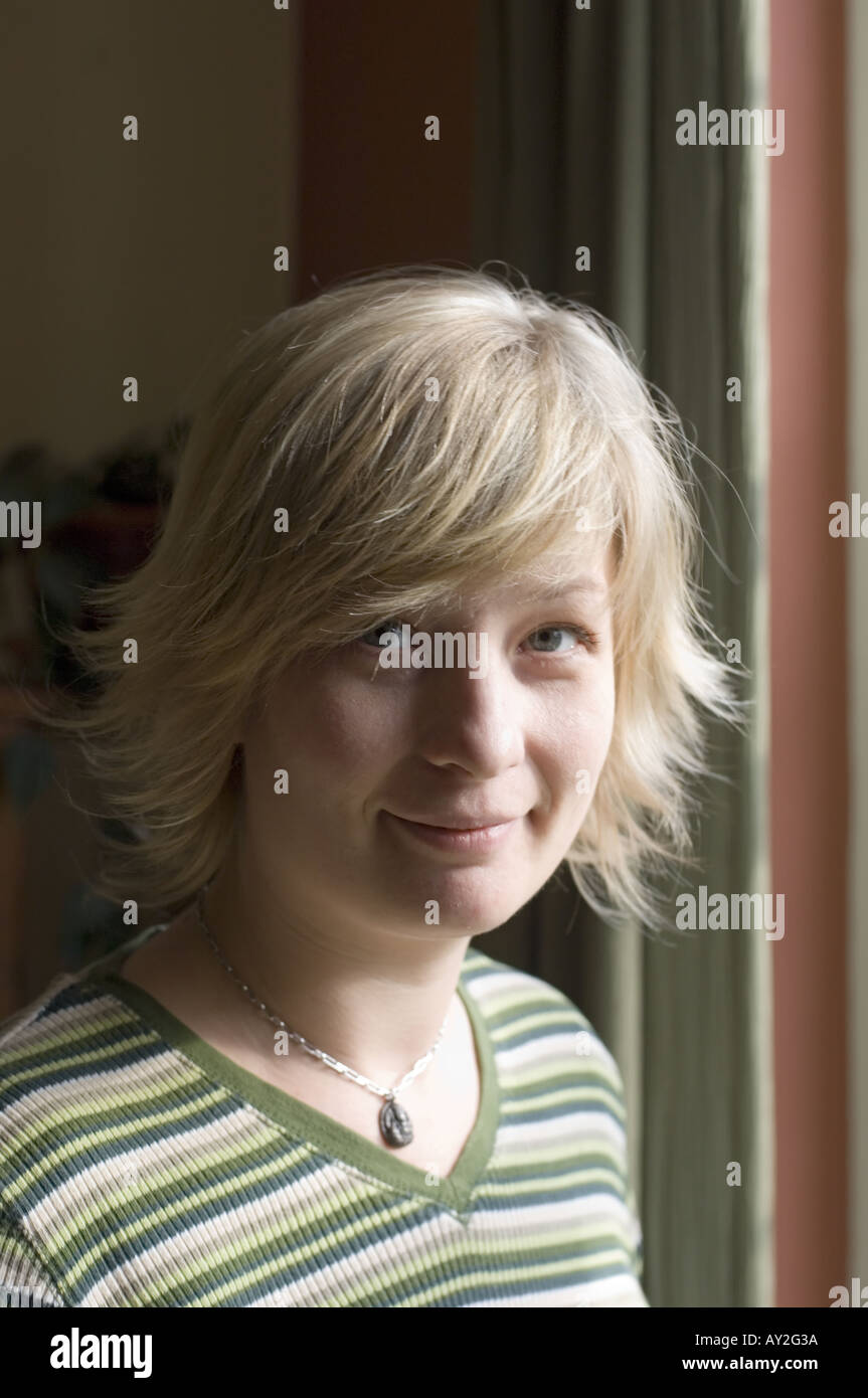 Blonde woman smiling sweetly Stock Photo - Alamy