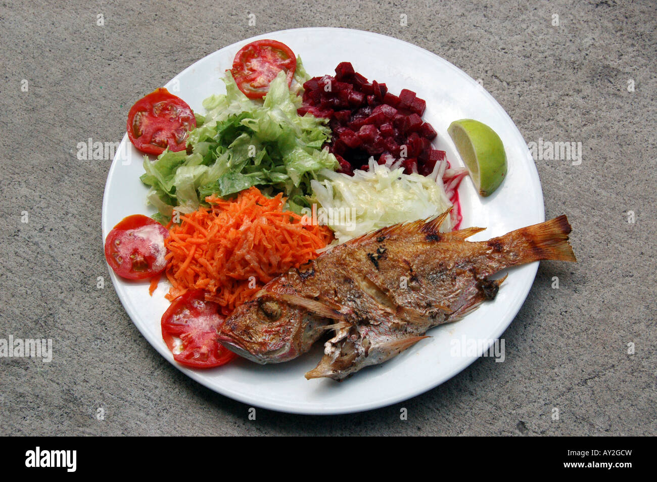 grilled fish and salad Stock Photo - Alamy