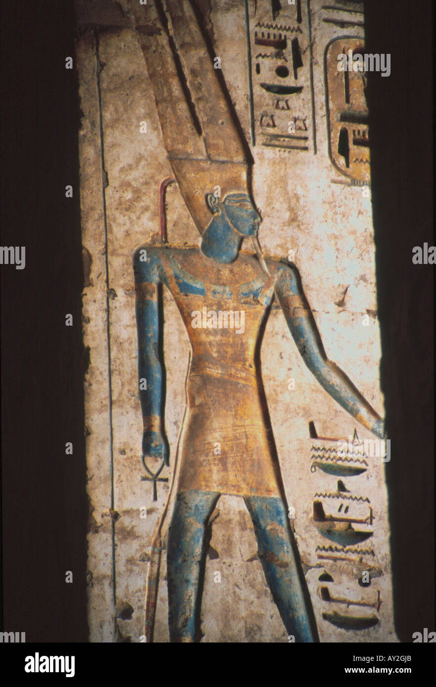 Painted relief image of Amun on the wall of the temple Medinat Habu, on ...