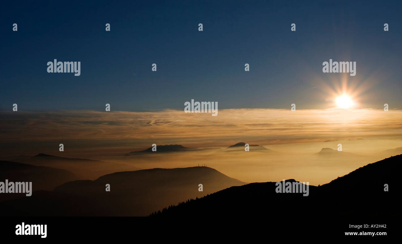 Panorama with mountains sun clouds and smooth blue sky Stock Photo - Alamy