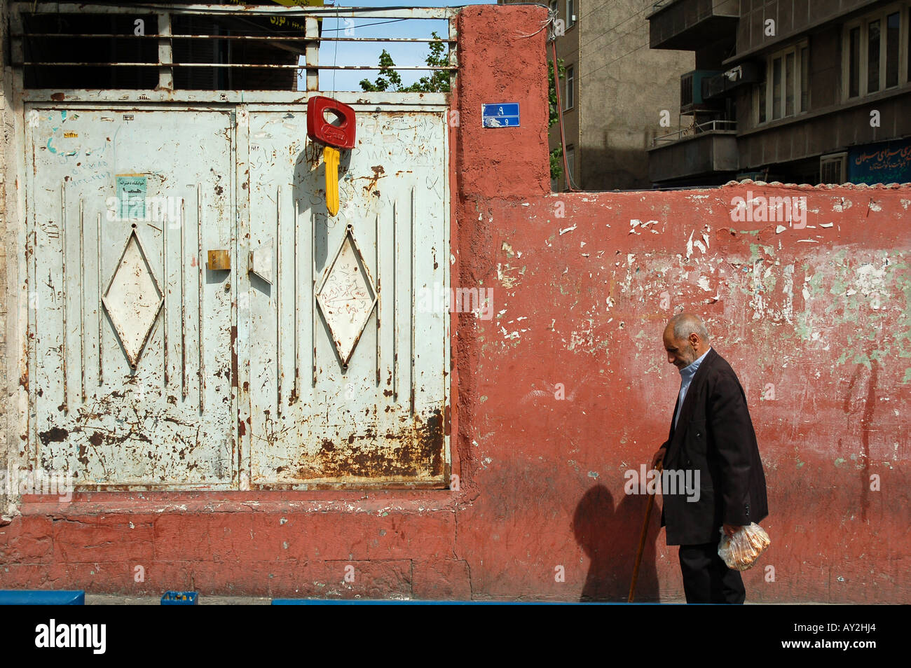 Old man and the key in Tehran Stock Photo - Alamy