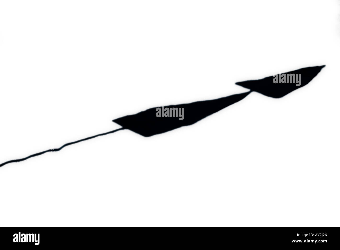 shadow of road sign in the snow arrow simbolic Stock Photo - Alamy