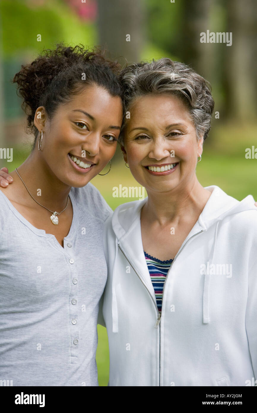 African American mother and adult daughter hugging Stock Photo - Alamy