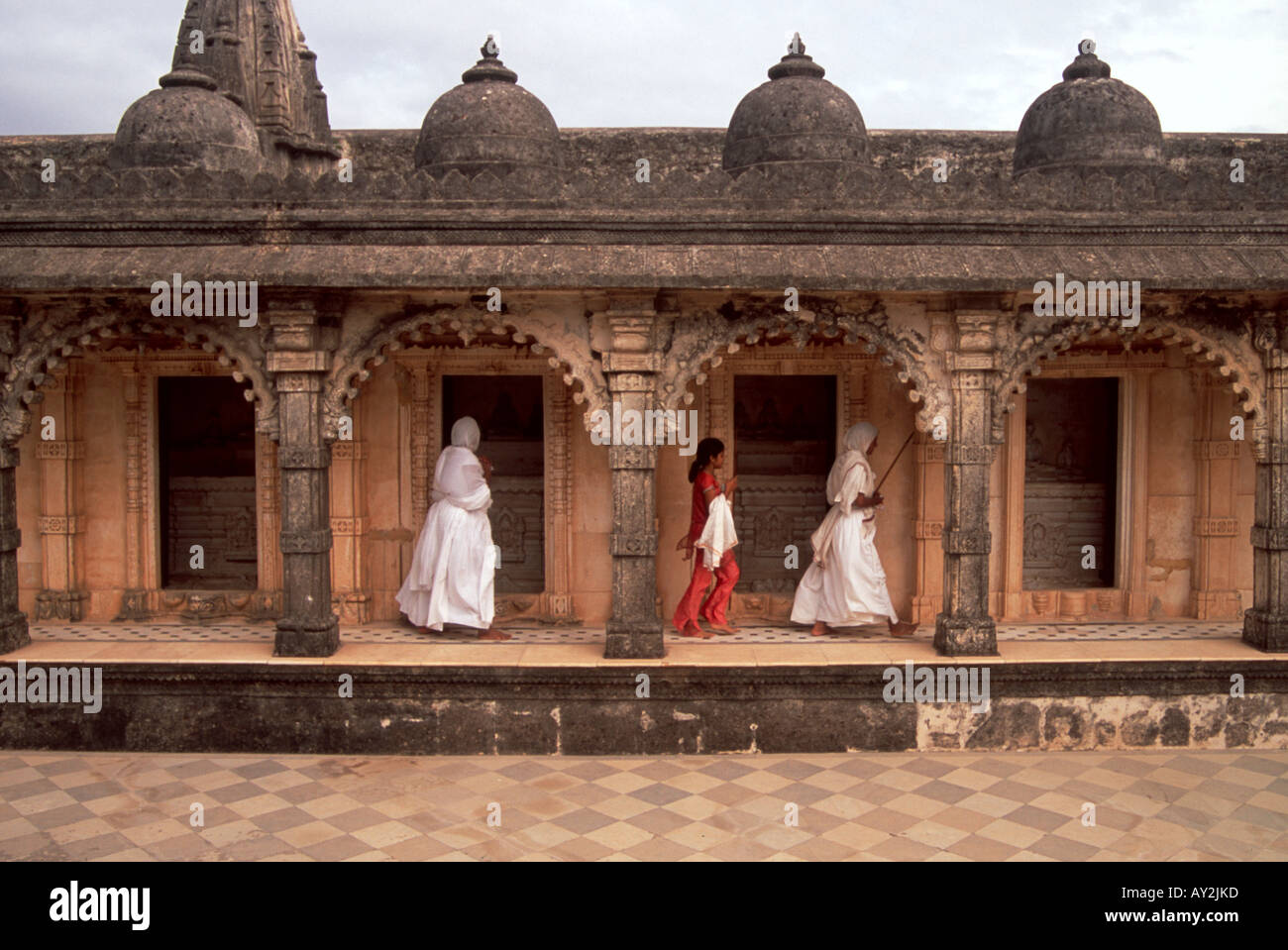 Jain nuns walking past shrines at Shatrunjaya hill Gujarat India Stock ...