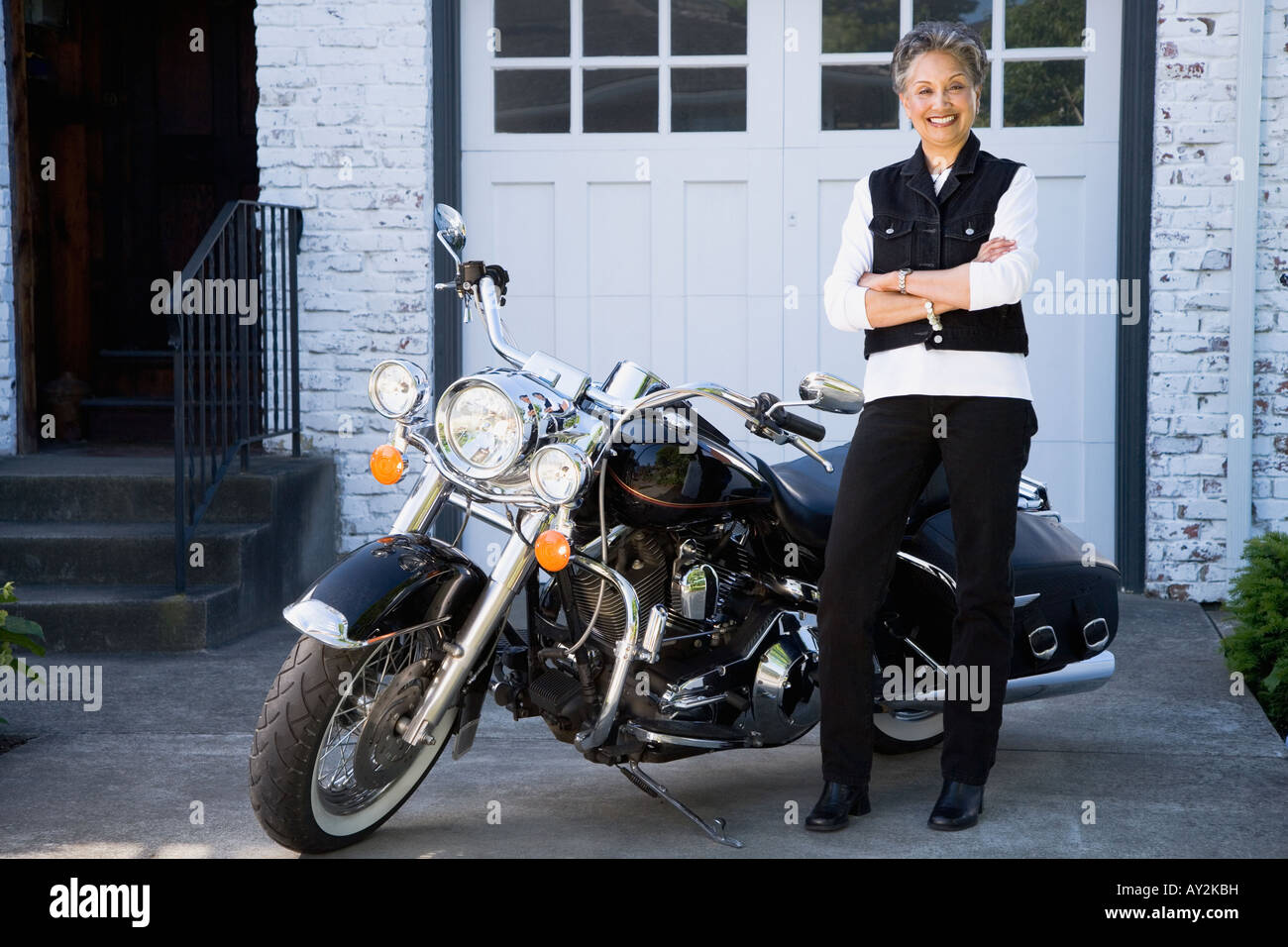 Woman standing next motorcycle hi-res stock photography and images - Alamy