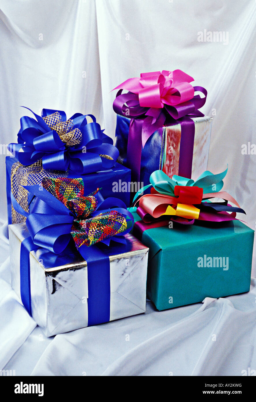 Four gift wrapped presents Stock Photo - Alamy