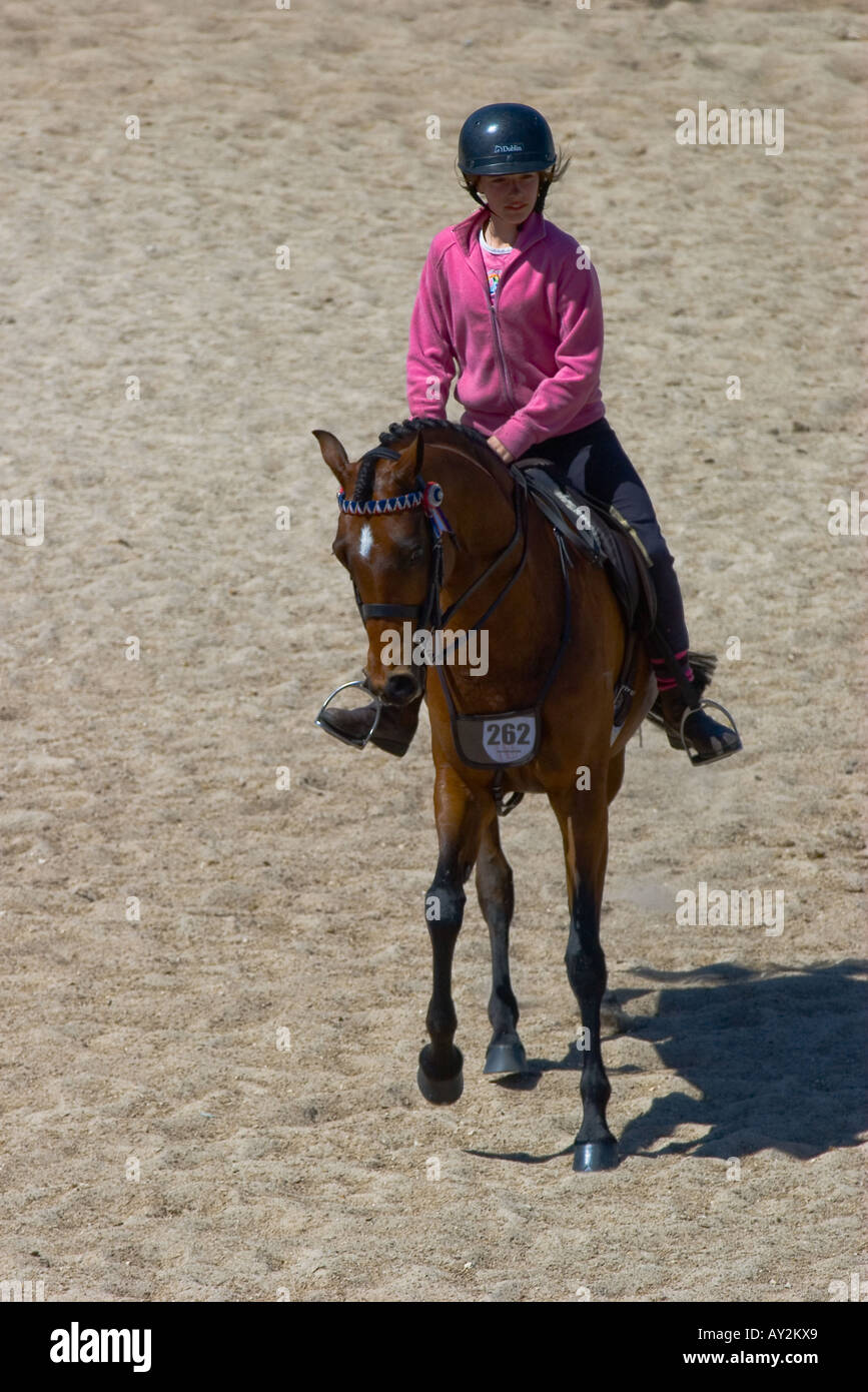 Young girl practicing dressage in a corral Stock Photo - Alamy
