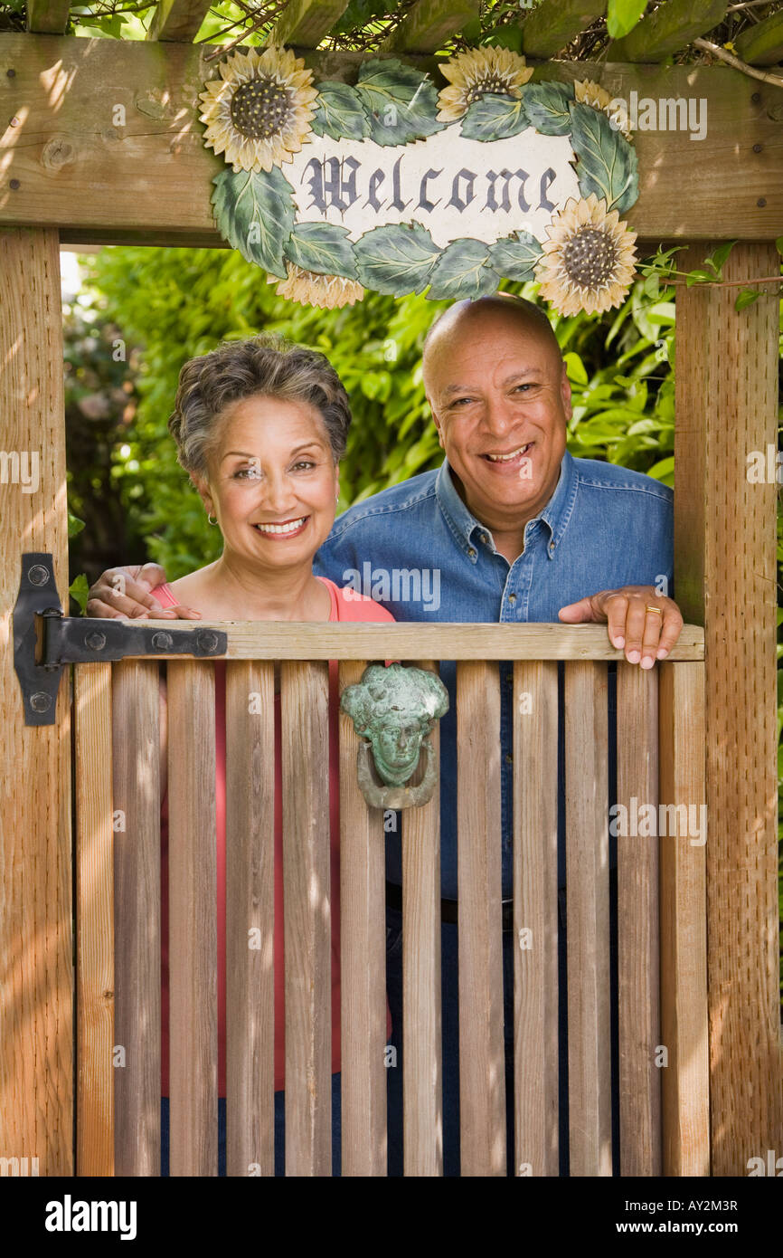 Senior African American couple looking over gate Stock Photo - Alamy