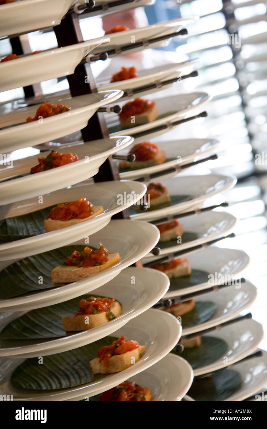 stacked dishes with appetizer in industrial kitchen ready for catering ...