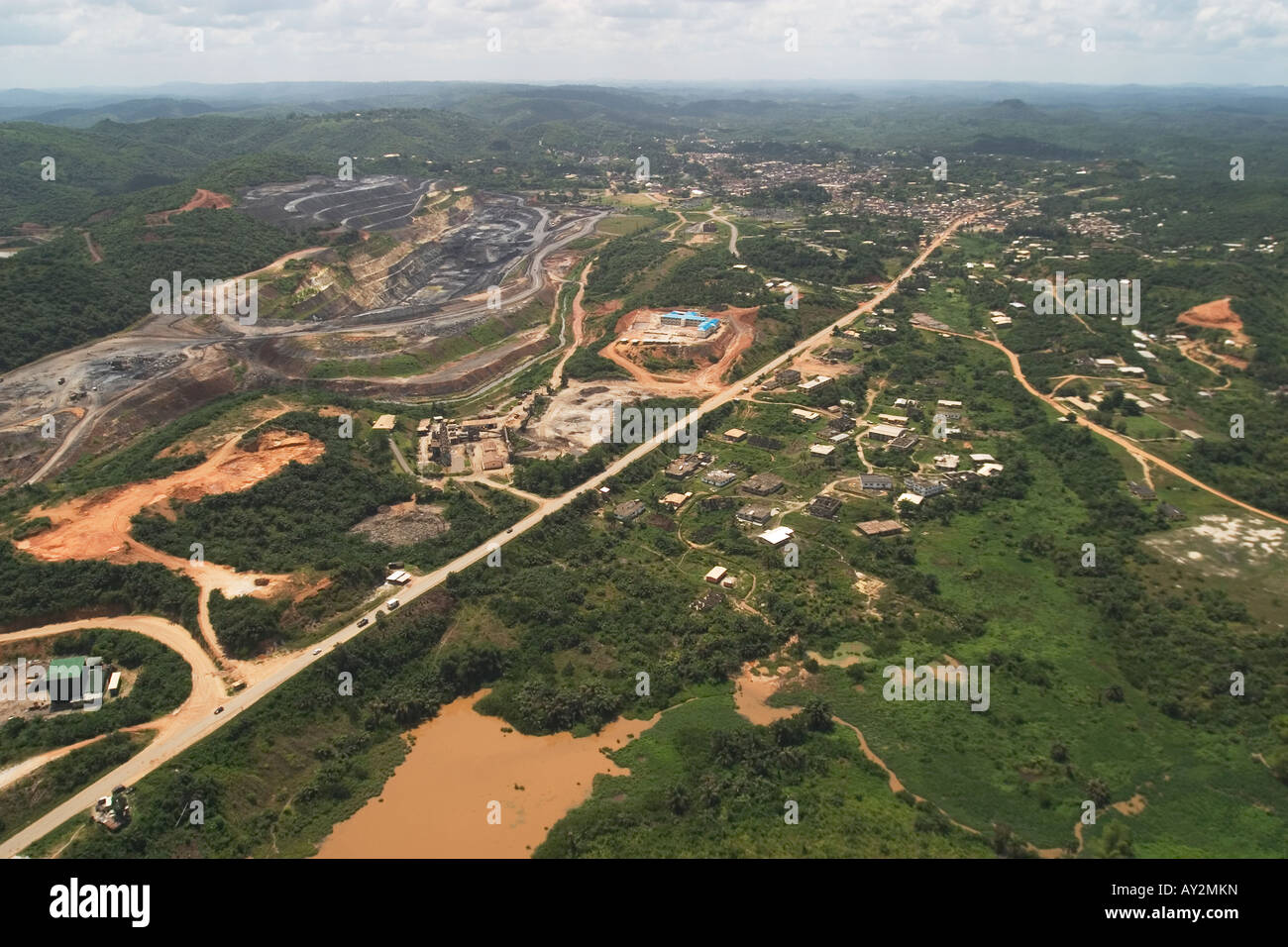 Aerial view of part of surface gold mine concession, showing mining pit ...