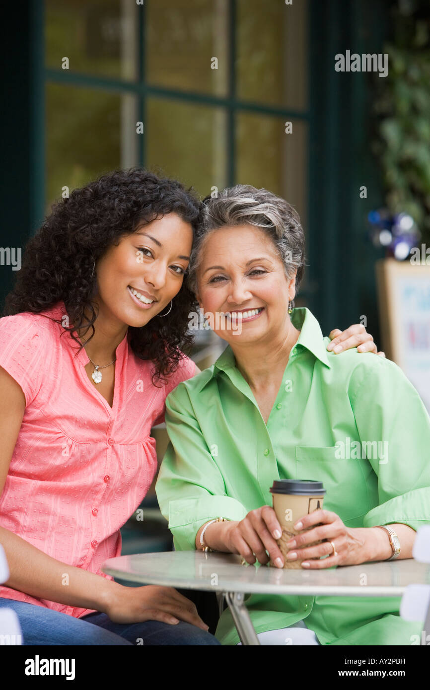 African American mother and adult daughter hugging Stock Photo - Alamy