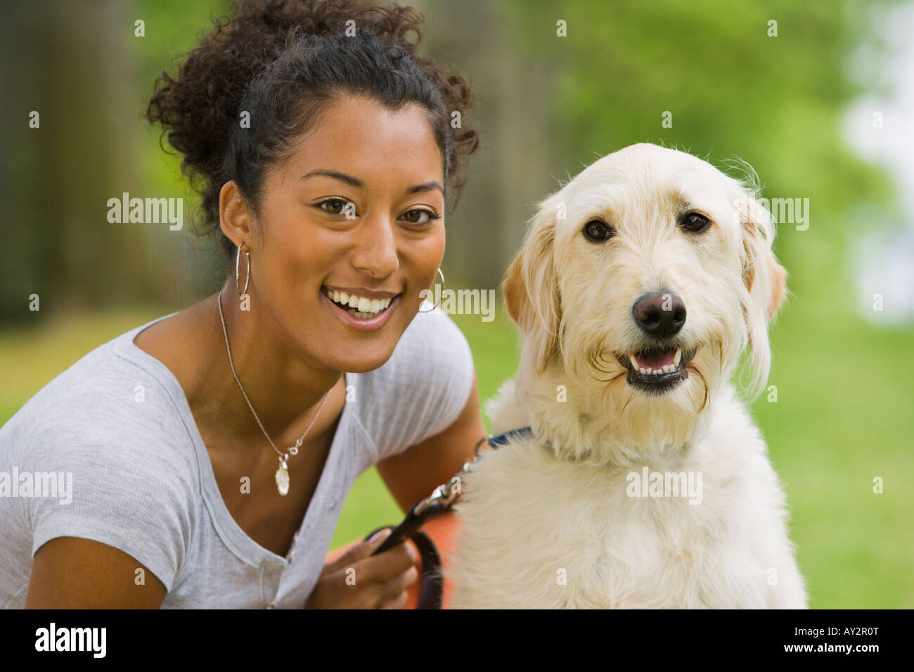 African American woman with dog Stock Photo - Alamy