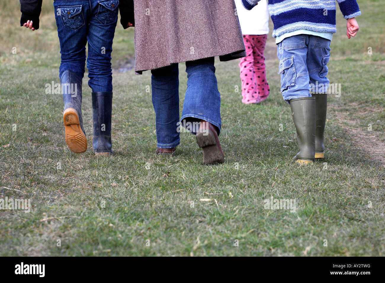 Feet and legs of family walking in the countryside Stock Photo - Alamy