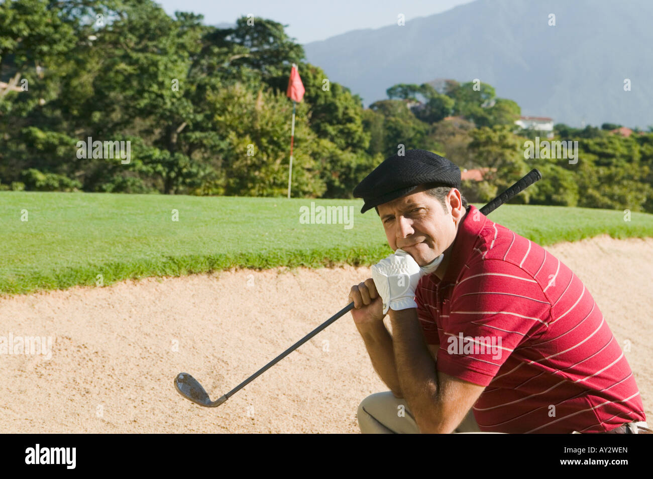 Hispanic man in golf course sand trap Stock Photo - Alamy