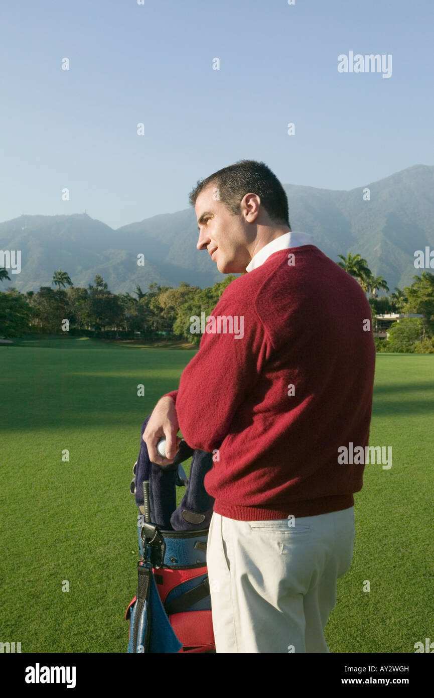 Hispanic man on golf course Stock Photo - Alamy