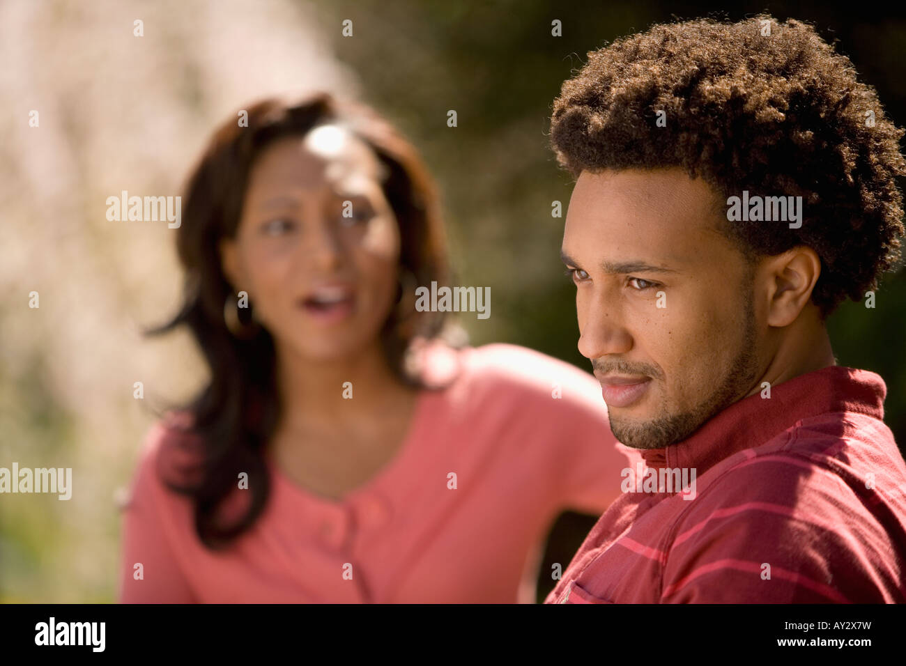 African American man ignoring girlfriend Stock Photo - Alamy